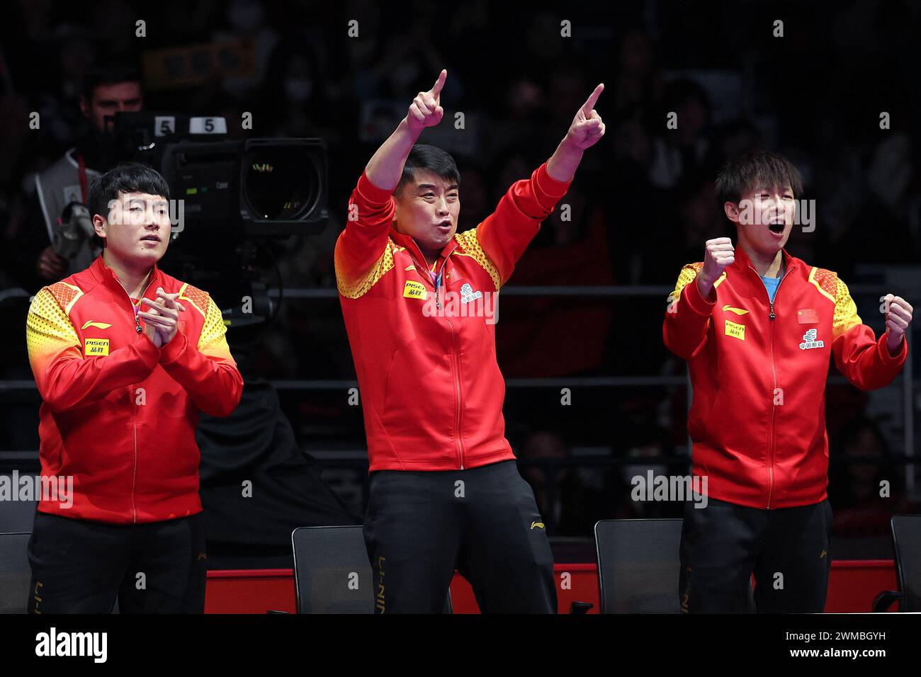Busan, South Korea. 25th Feb, 2024. China's coach Wang Hao (C), player Liang Jingkun (L) and Lin ...