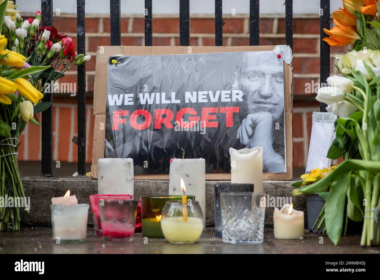 London, UK. 24th Feb, 2024. Candles are burning in front of the image ...
