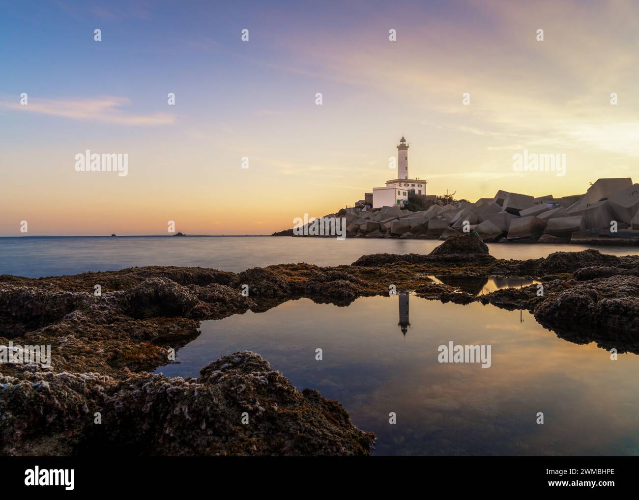 Peaceful landscape view of the Botafoc Lighthouse in Ibiza Town Port at ...