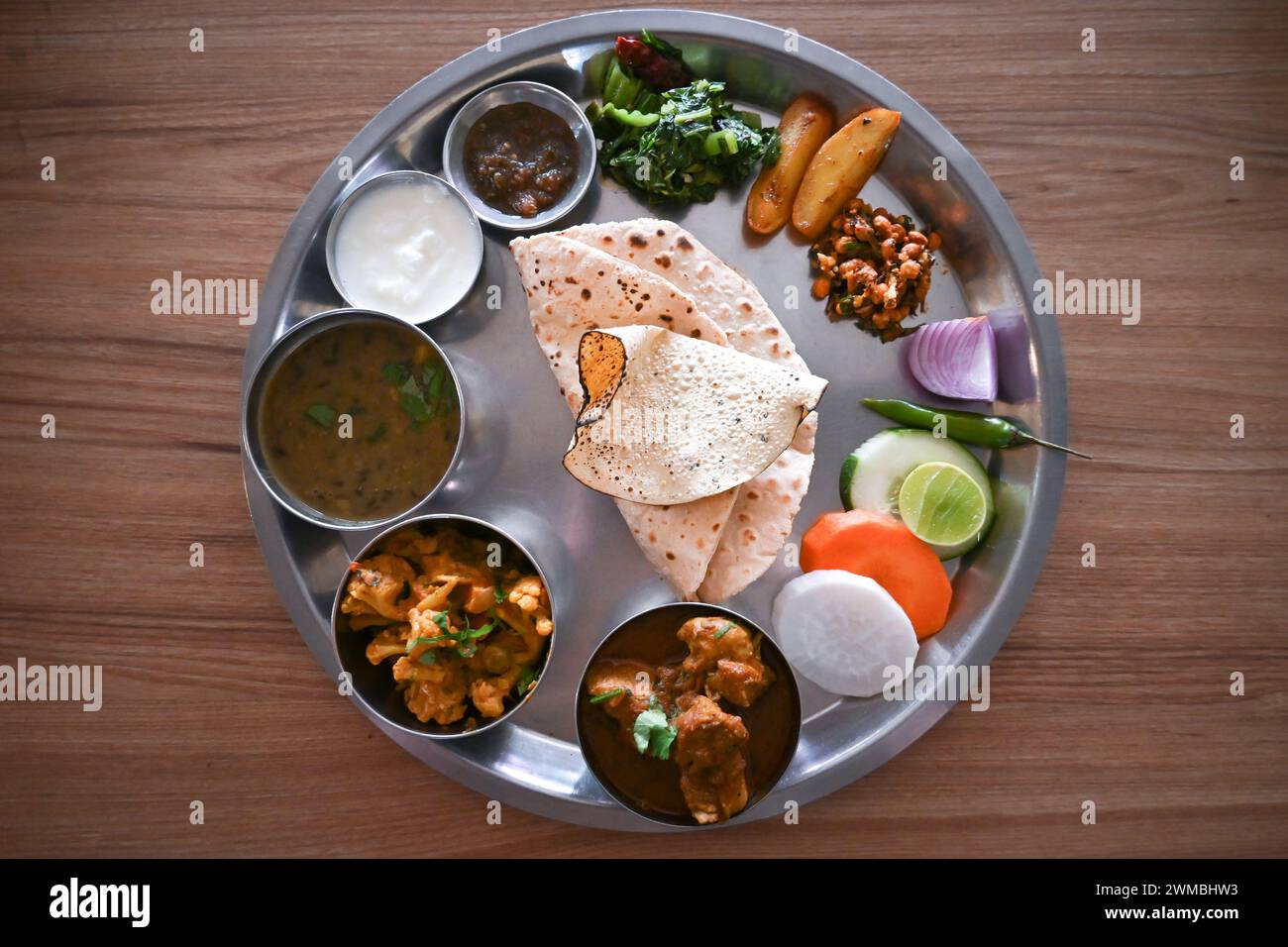 Top view of a nepalese thali set, a dish typically consisting of rice ...