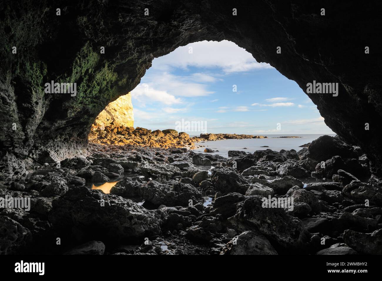 View from a sea cave on the Seaham Blast beach at sunrise, Durham ...