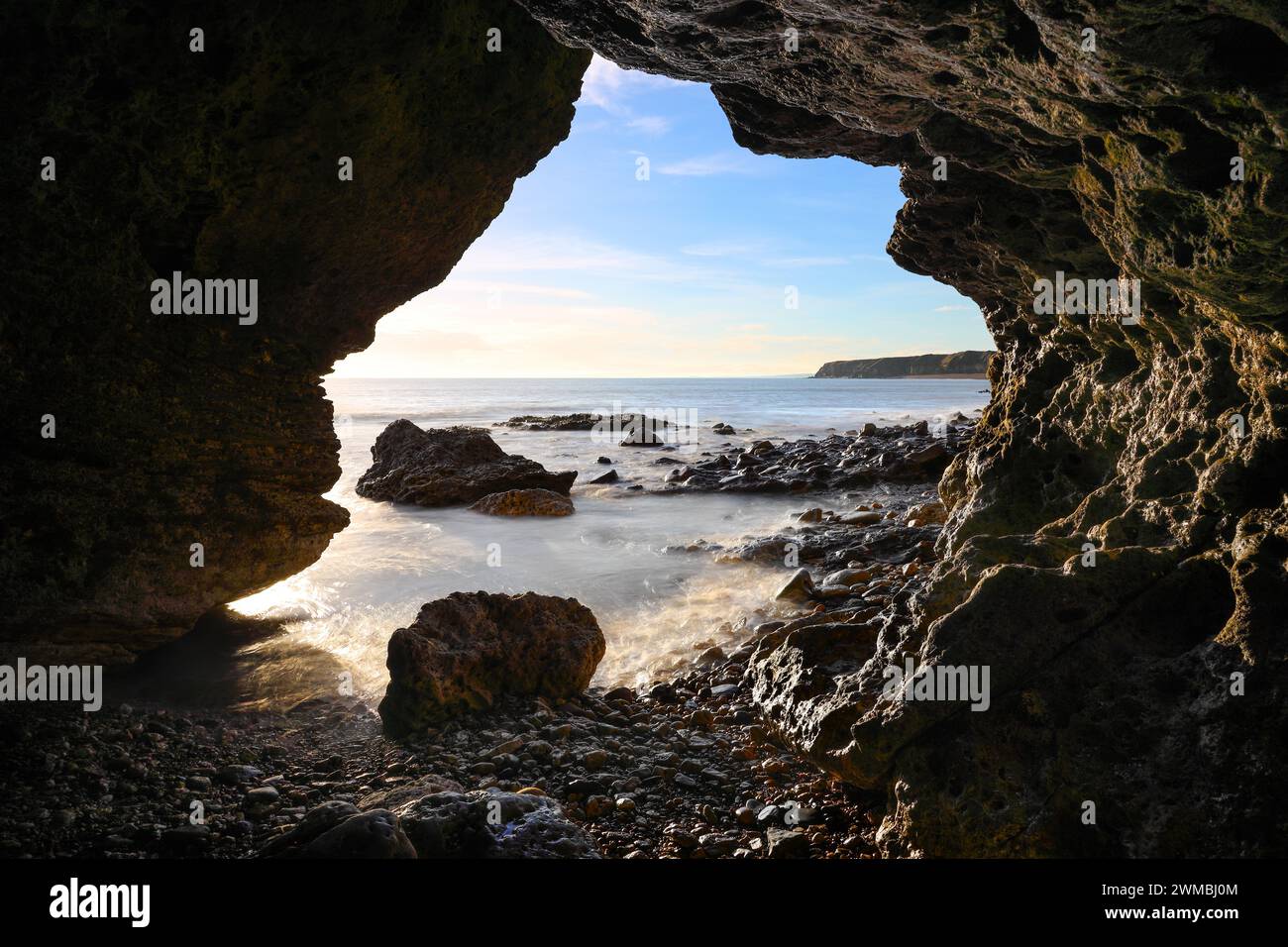 View from a sea cave on the Seaham Blast beach at sunrise, Durham ...