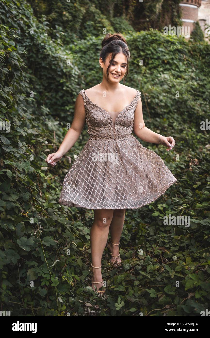 Beautiful teen brunette girl in a golden dress. Ready for prom Stock ...