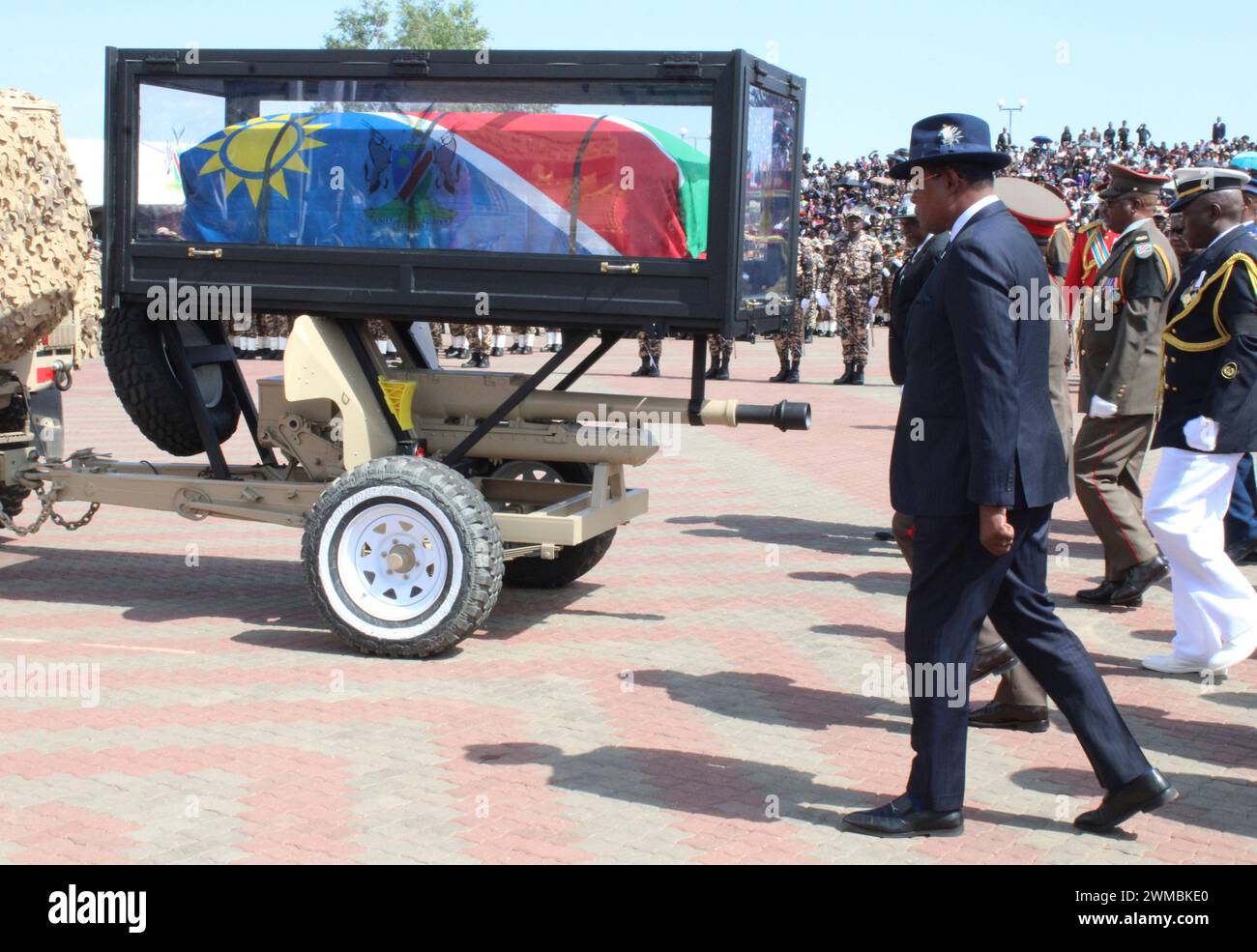 Mourners follow the flag-draped coffin of the late Namibian President ...