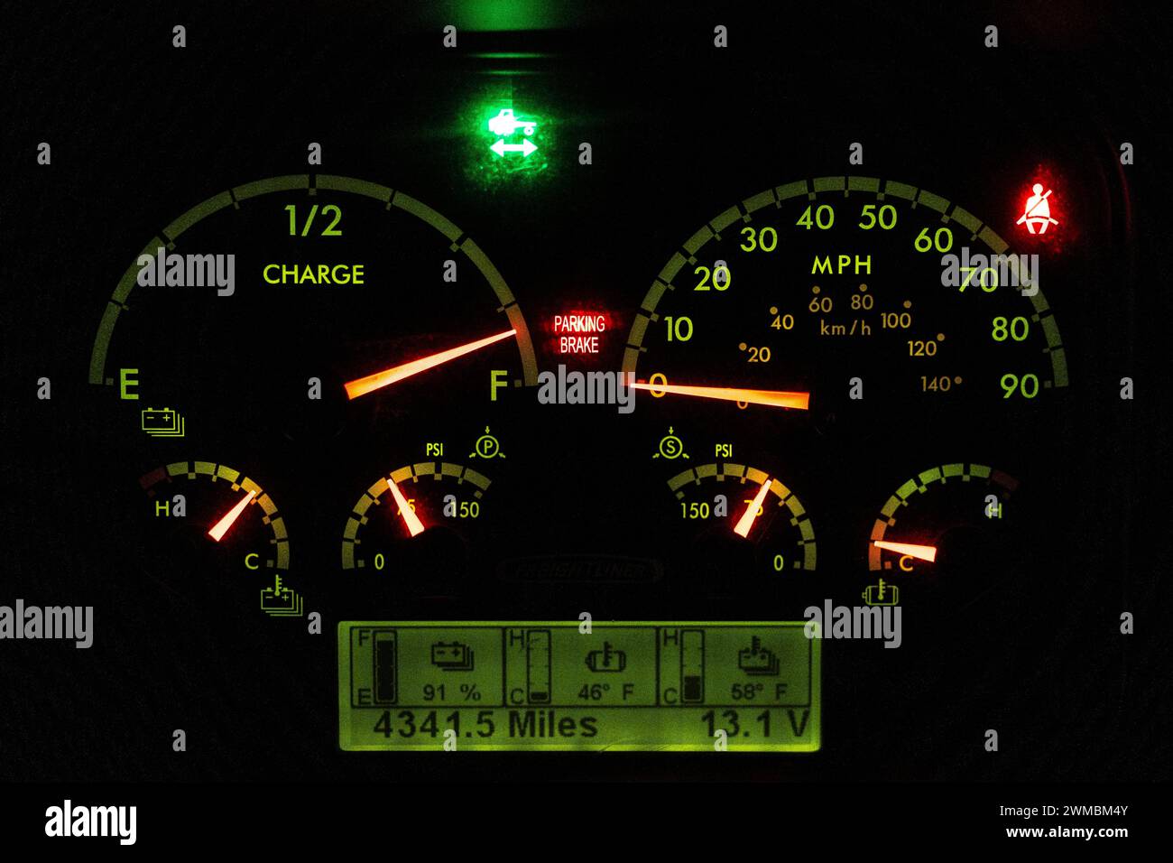 A dashboard of an electric school bus is visible during morning startup ...