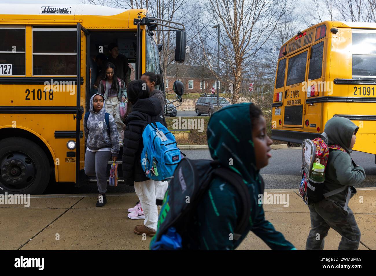 Rock Creek Forest Elementary School students exit a diesel bus before ...
