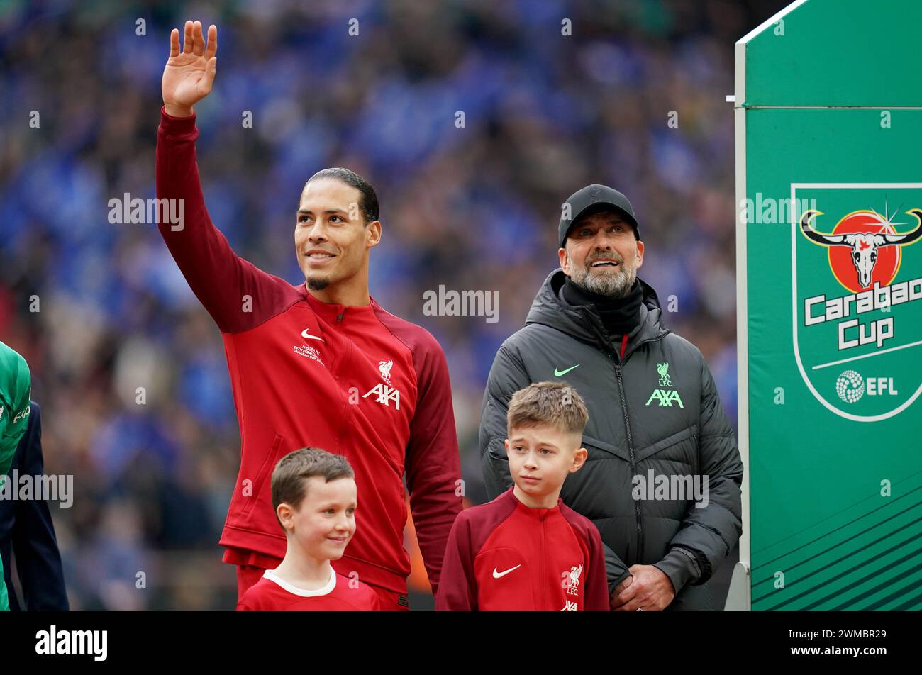 Liverpool's Virgil van Dijk (left) and manager Jurgen Klopp line up on ...