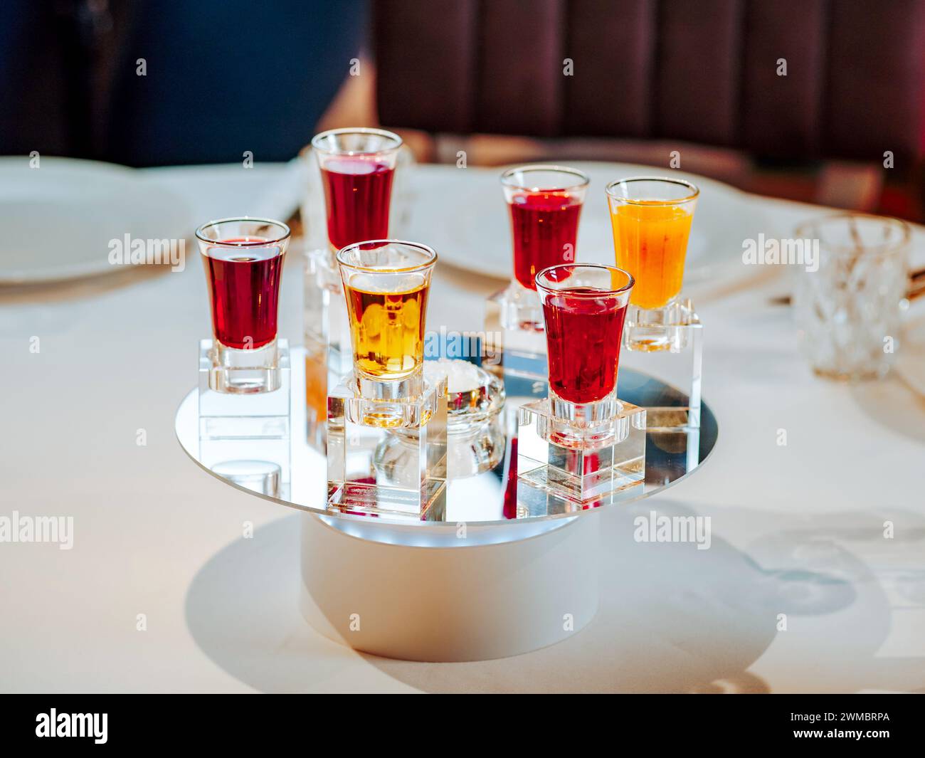 Set of colorful different bitters and liqueurs in shot glasses on ...