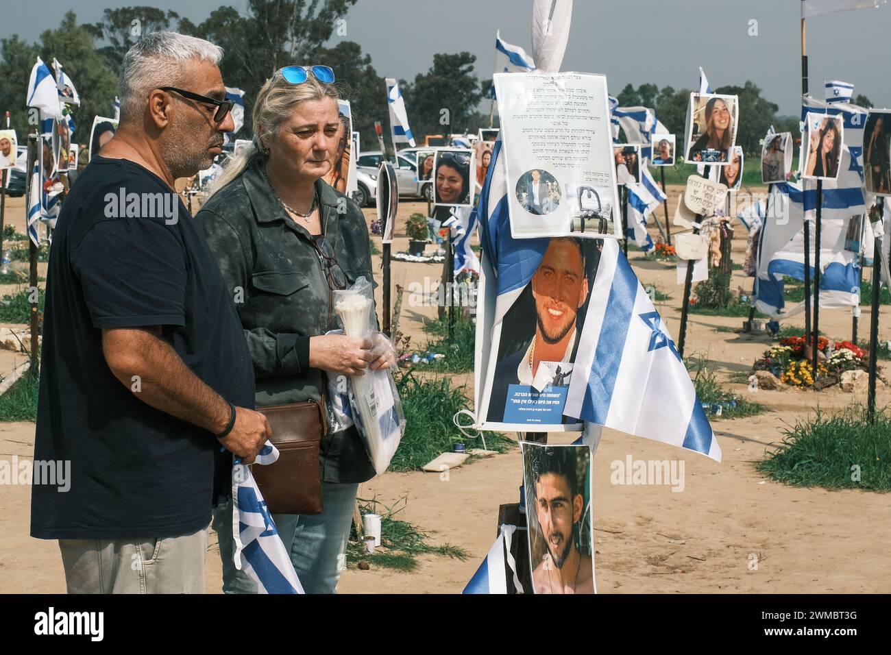 Kibbutz Reim, Israel. 25th Feb, 2024. Visitors join grieving families ...