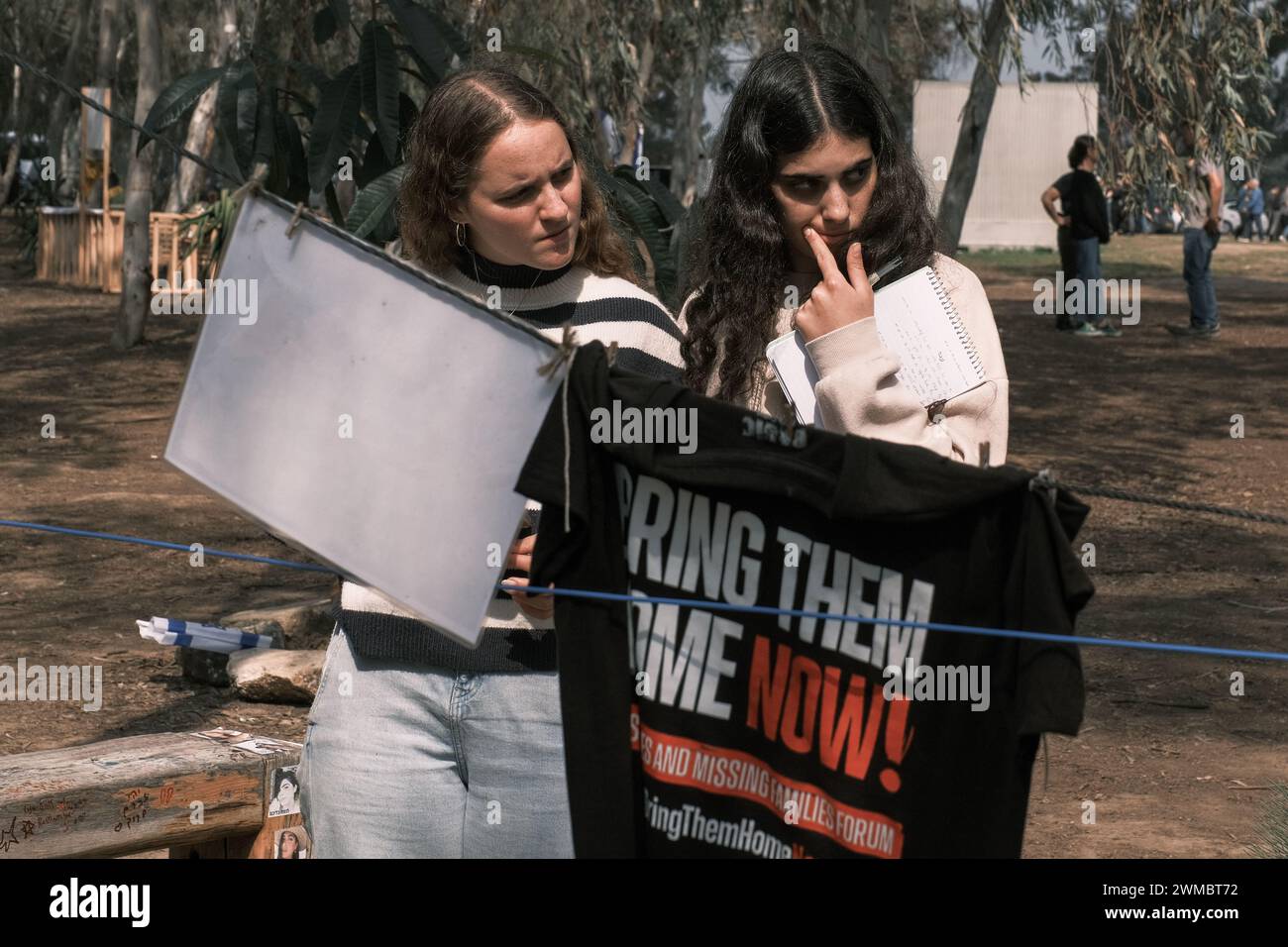 Kibbutz Reim, Israel. 25th Feb, 2024. Visitors join grieving families ...