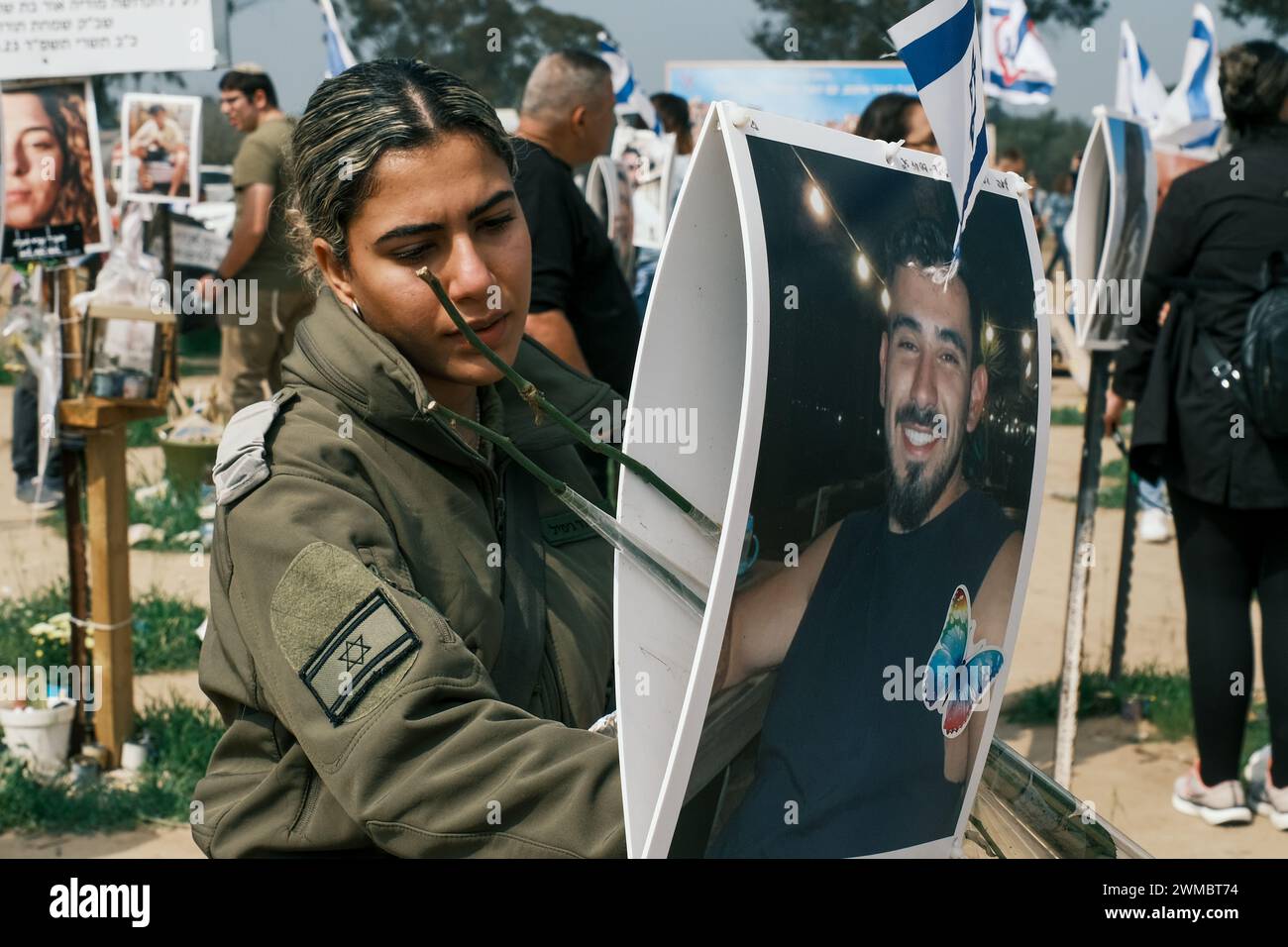 Kibbutz Reim, Israel. 25th Feb, 2024. Visitors join grieving families ...