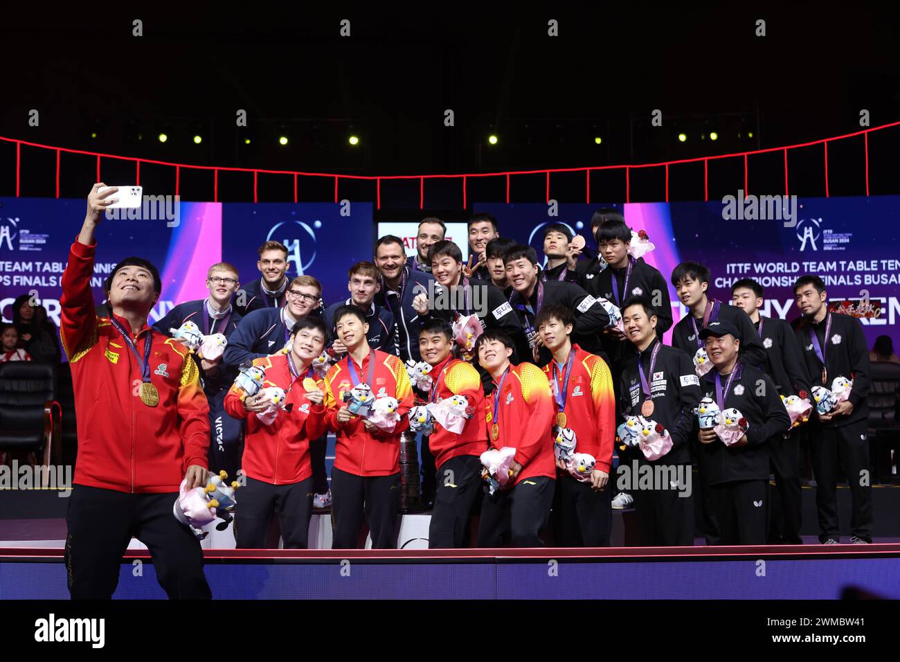 Busan, South Korea. 25th Feb, 2024. Gold medalists team China (front), silver medalists team ...