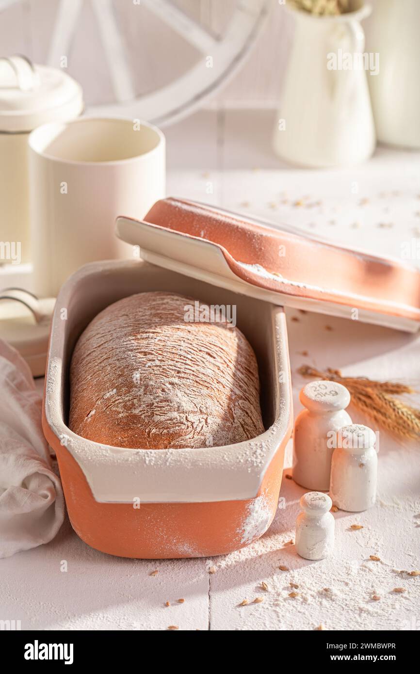 Hot loaf of bread as source of fiber and energy. Bread in countryside ...