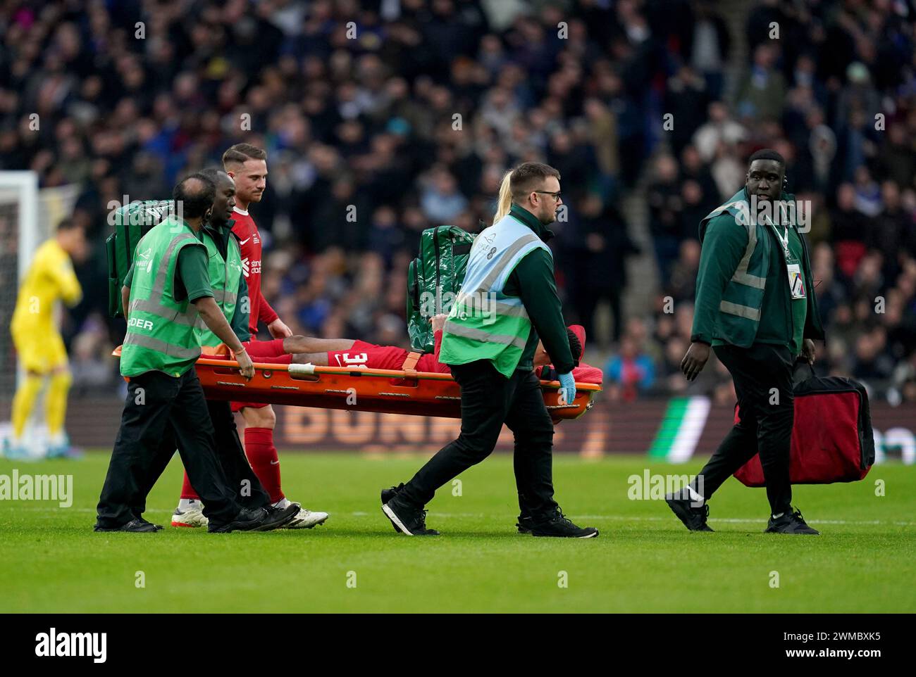 Liverpool's Ryan Gravenberch is carried off the pitch on a stretcher ...