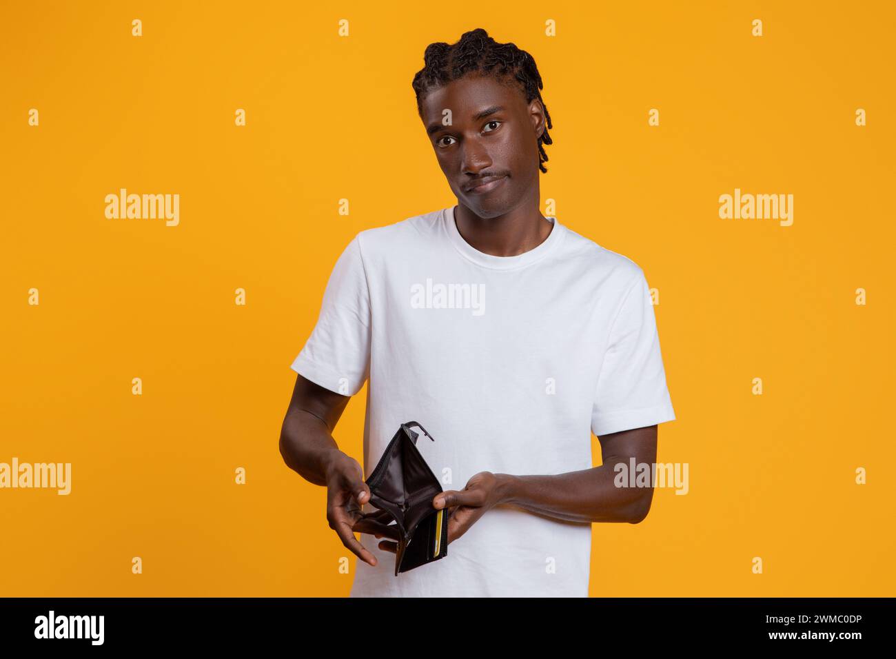 Poverty Concept. Upset Young Black Man Showing Empty Wallet At Camera Stock Photo - Alamy