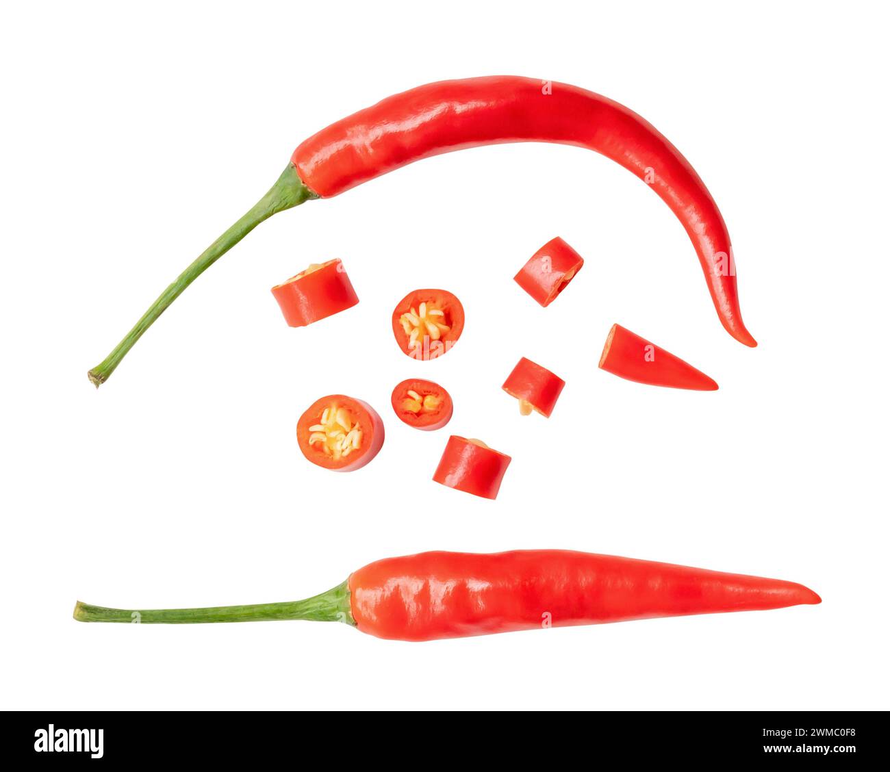 Top view and flat lay of curved fresh red chili peppers with slices in ...