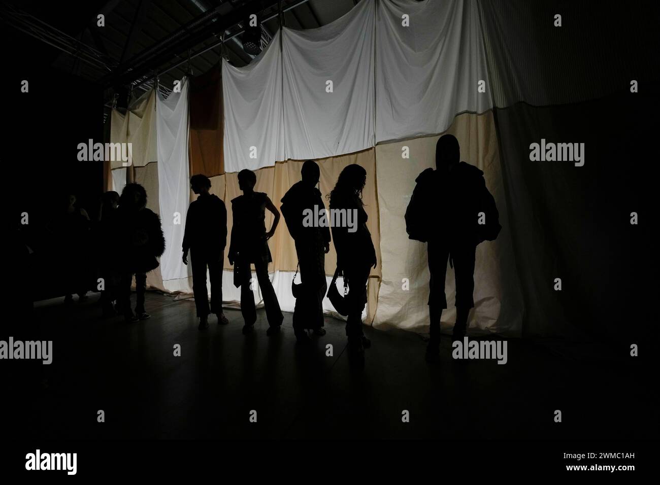 Models get ready in the backstage of the Rave Review women's Fall ...