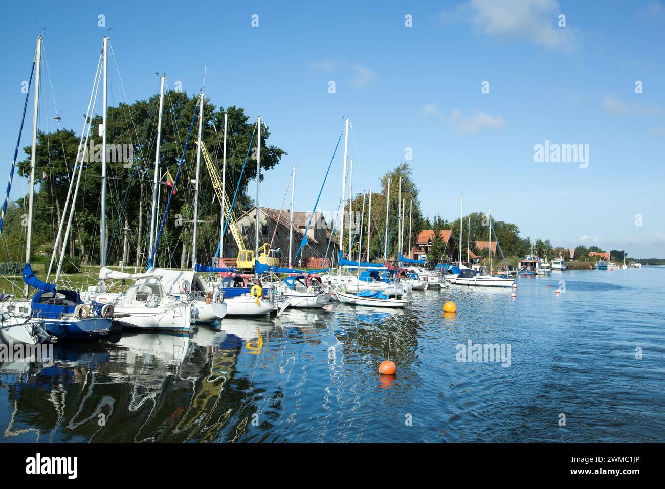 The view of Minija River that serves as a main street in Minge village ...