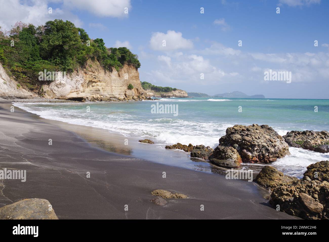 Beautiful rugged Balenbouche Beach - the sand is black due to basalt ...