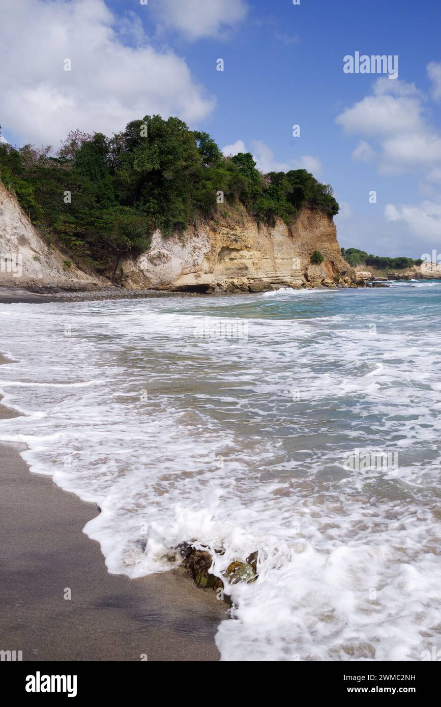 Beautiful rugged Balenbouche Beach - the sand is black due to basalt ...