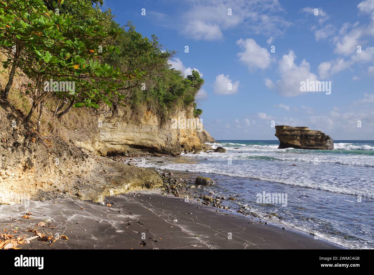 Beautiful rugged Balenbouche Beach - the sand is black due to basalt ...