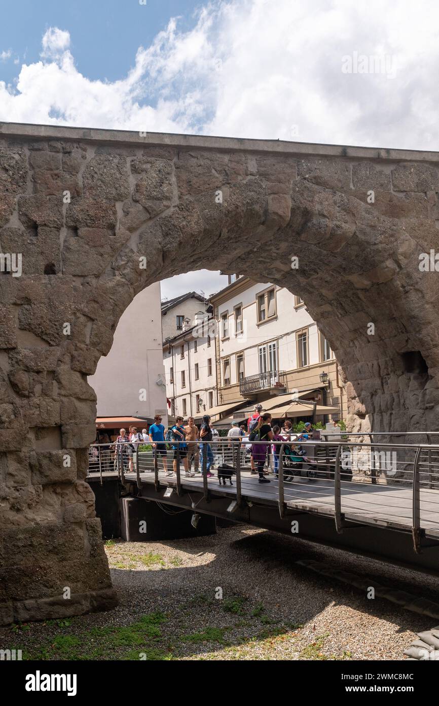 Tourists crossing the Pretoria Gate (25 BC), the Roman city gate ...