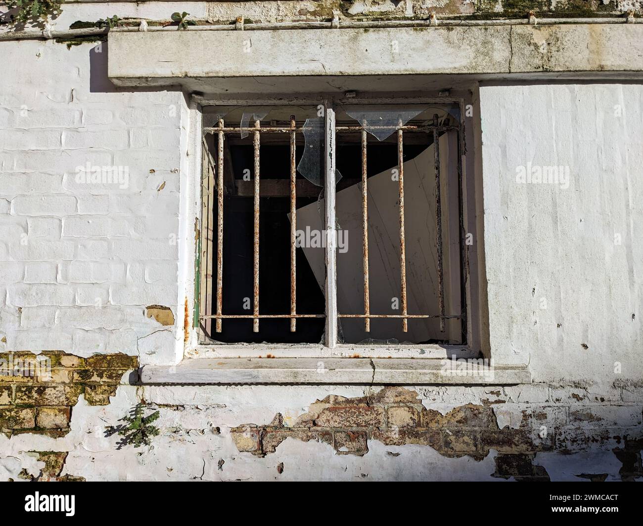 A Smashed Broken Window with Chipped Wall Down an AlleyWay Abandoned ...