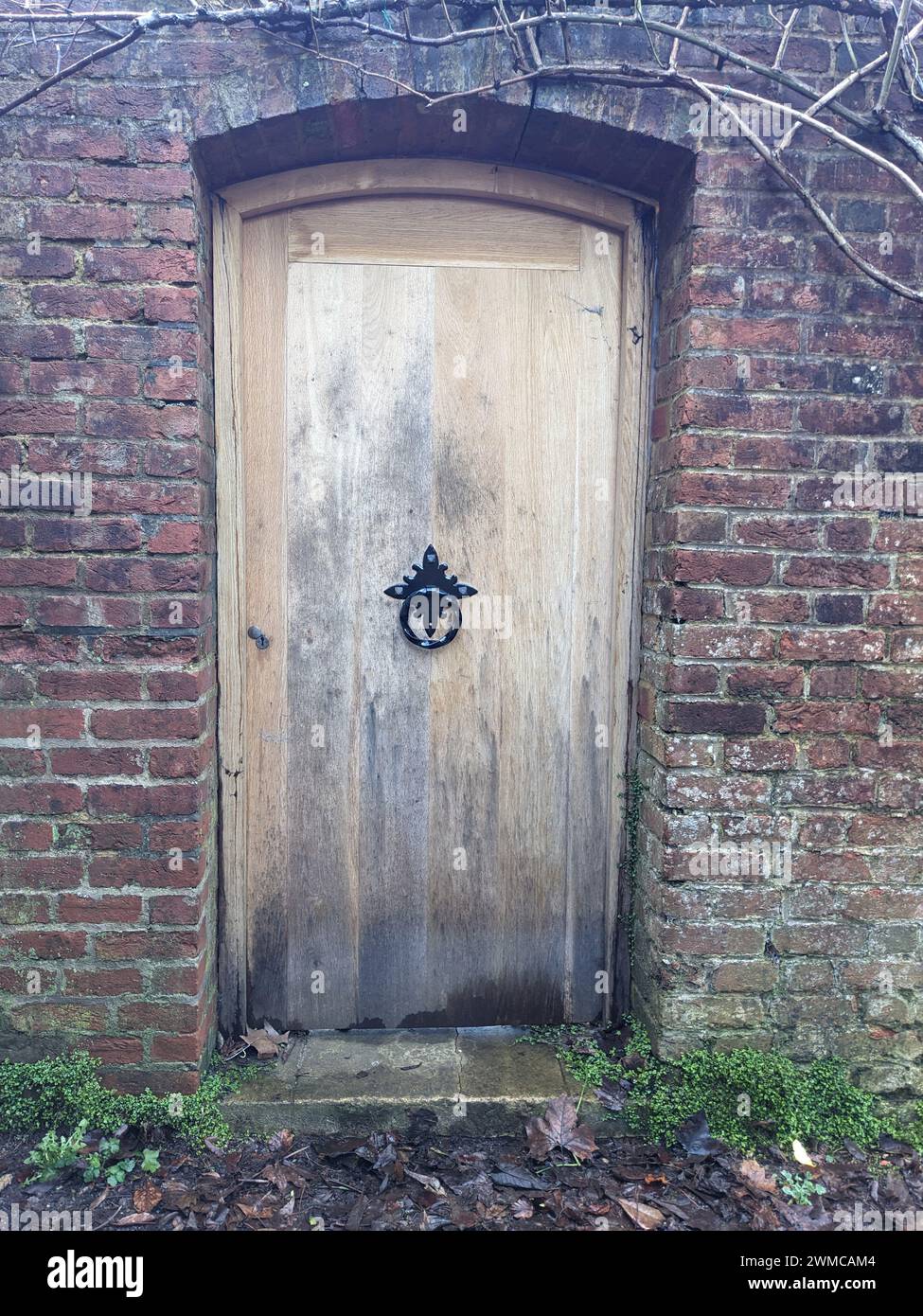 A Antique Historic Secret Door in a Stone Wall Stock Photo - Alamy
