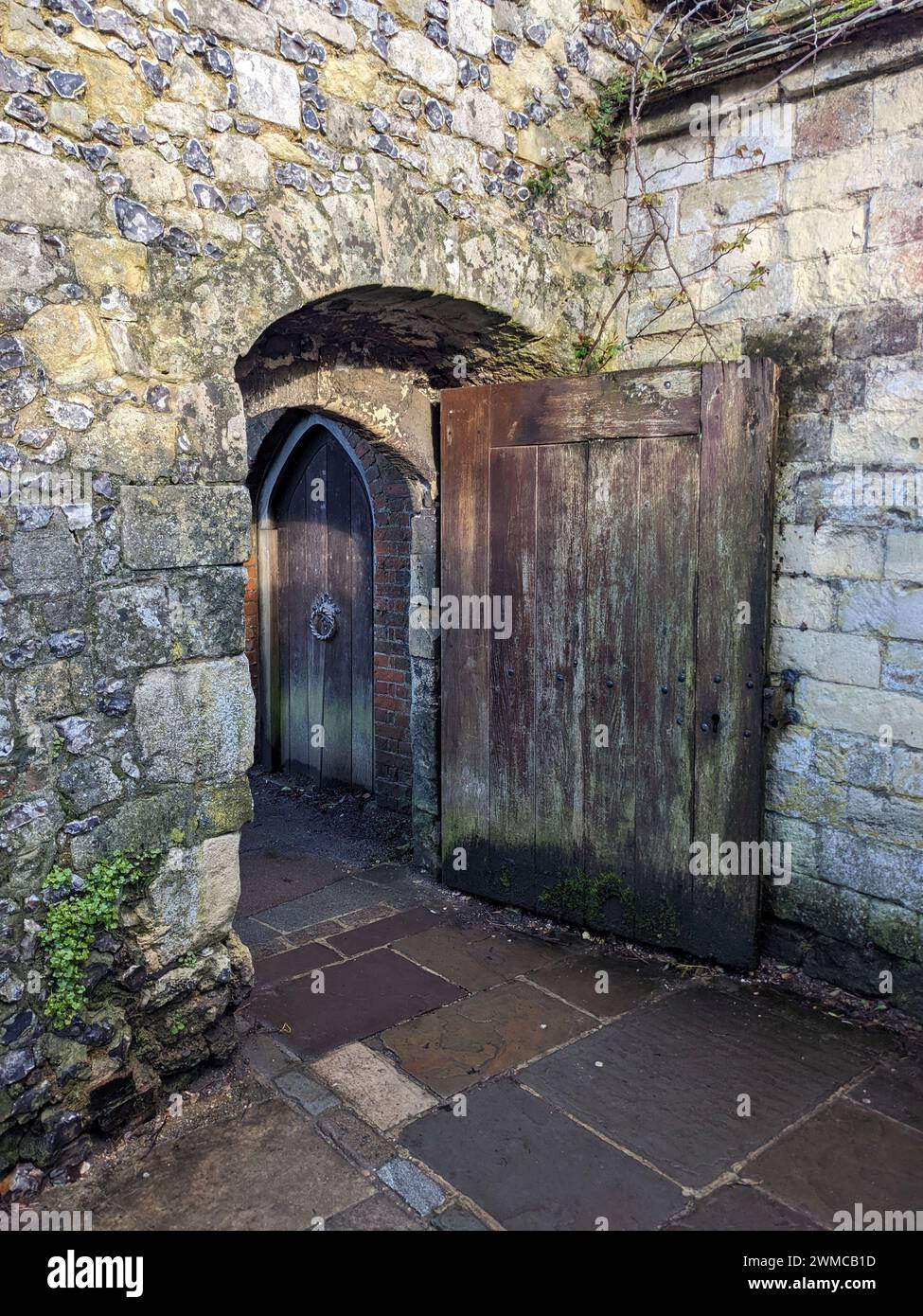 A Antique Historic Secret Door in a Stone Wall Stock Photo - Alamy