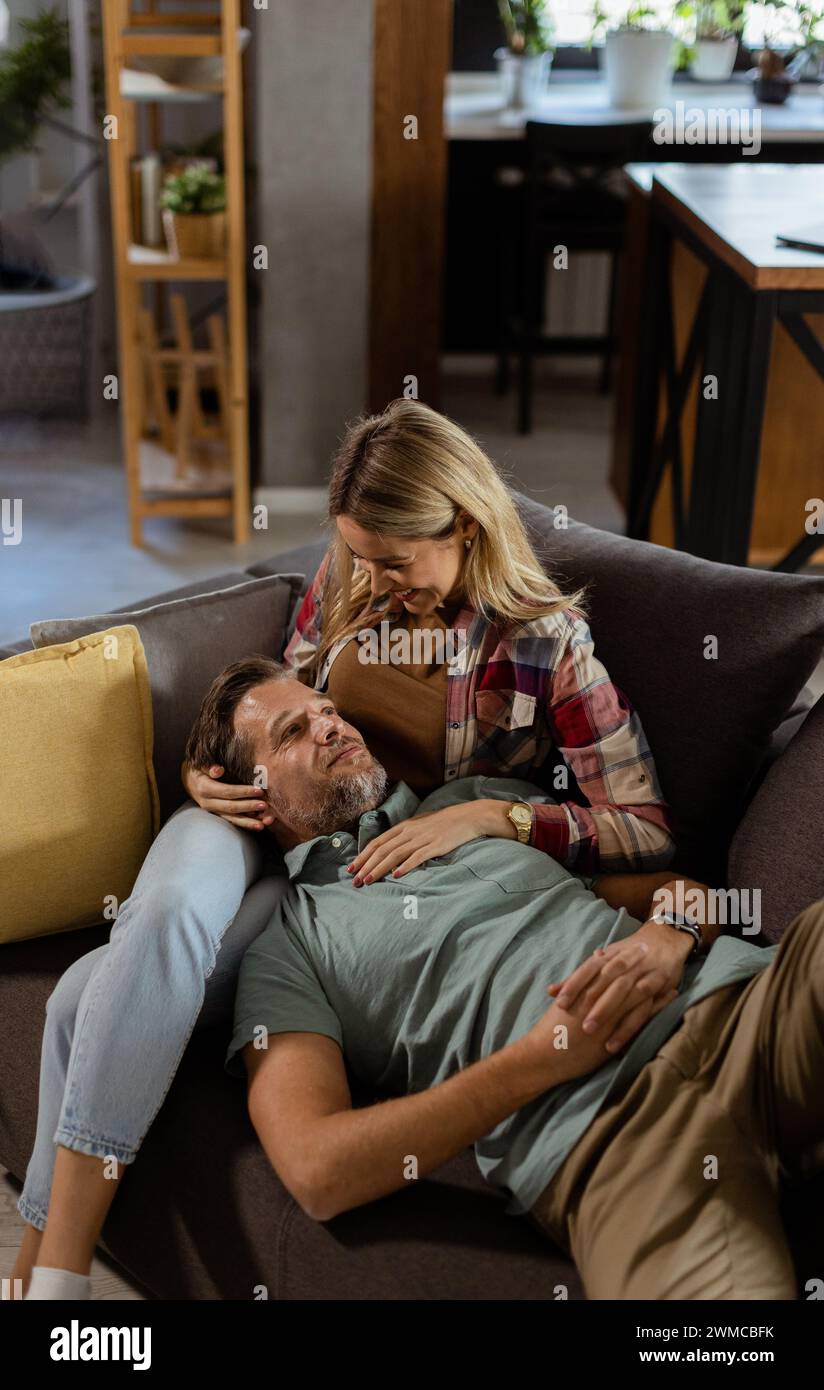 Couple shares a tender and peaceful moment as one rests their head on ...