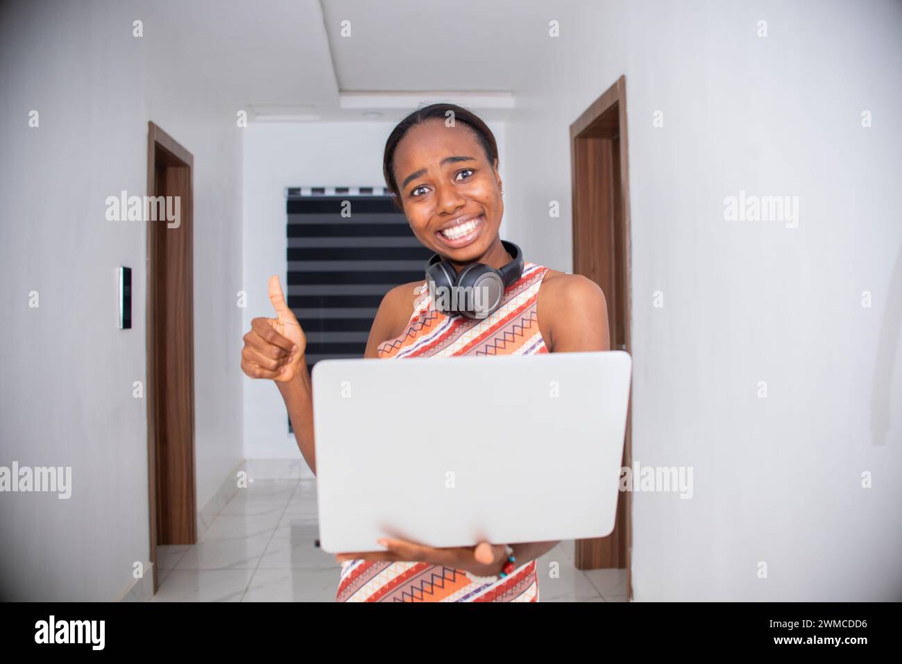 beautiful excited lady smiling about what she saw on her system Stock ...