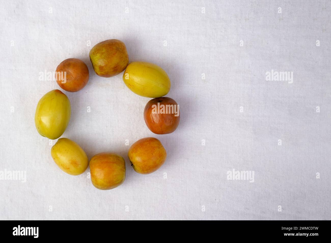 Top side view of Bair or Jujube fruit decorated in round shape isolated ...