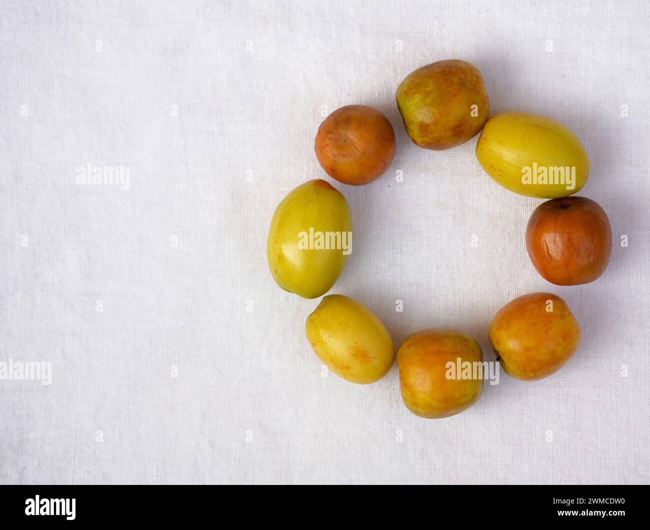 Top side view of Bair or Jujube fruit decorated in round shape isolated ...