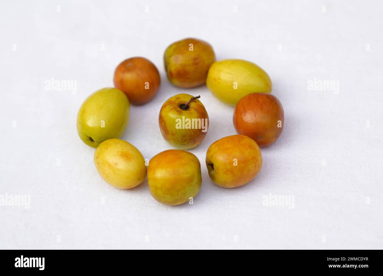 Top side view of Bair or Jujube fruit decorated in round shape isolated ...