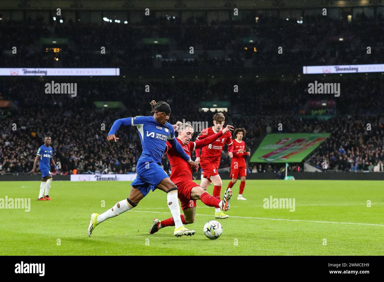 Kostas Tsimikas of Liverpool tackles Noni Madueke of Chelsea during the ...