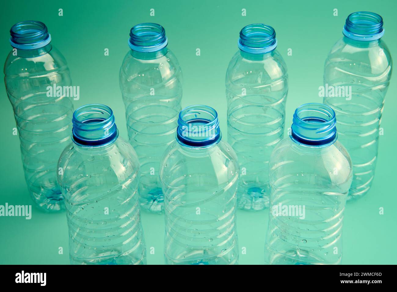 Top view plastic bottle on green background Stock Photo - Alamy