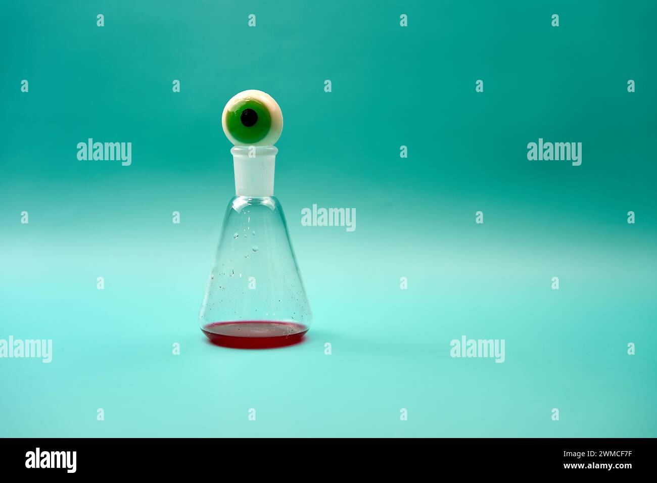 eye prosthesis on top of an Erlenmeyer flask with blood Stock Photo - Alamy