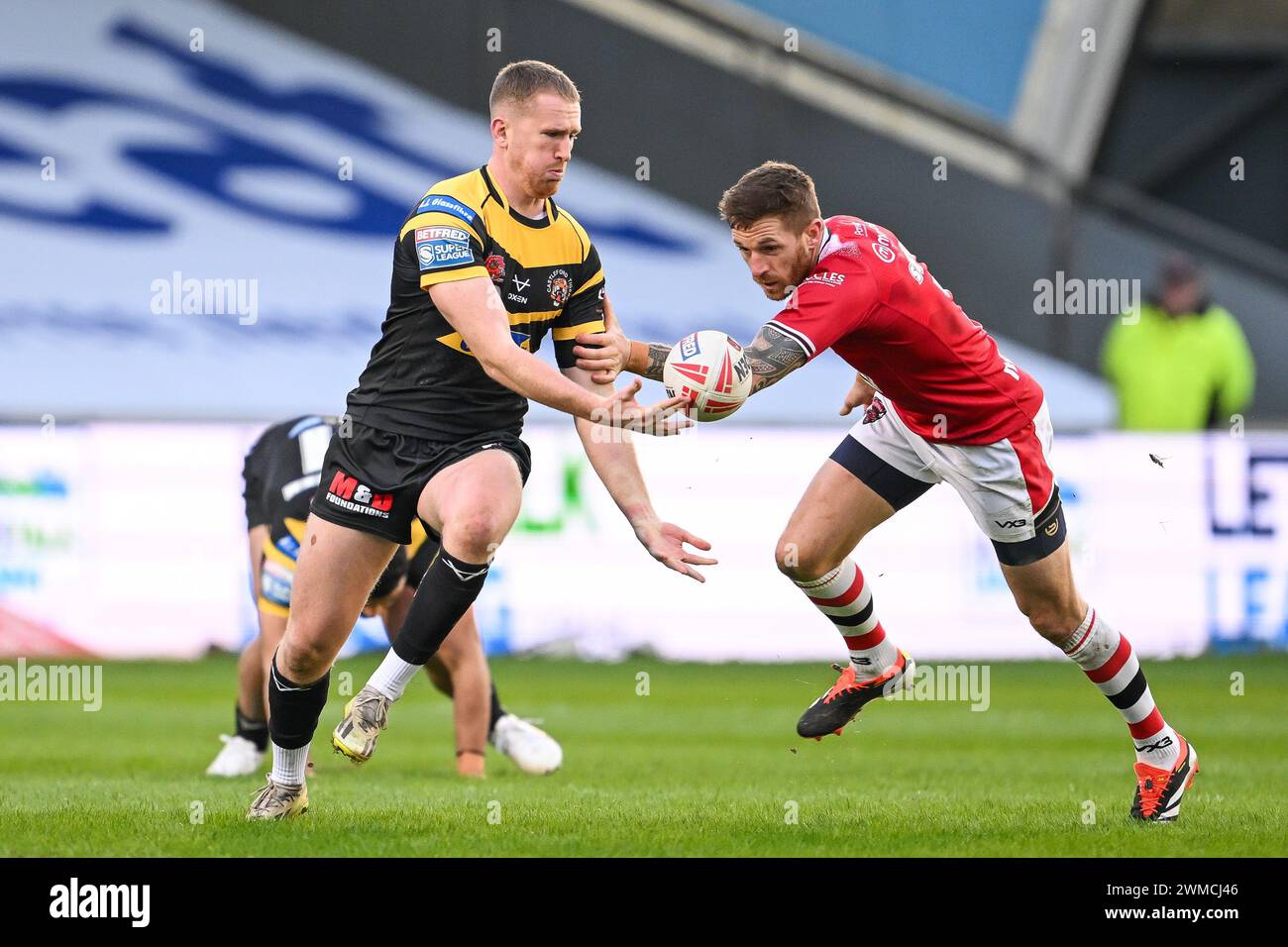 Rowan Milnes of Castleford Tigers is tackled by Marc Sneyd of Salford Red Devils during the ...