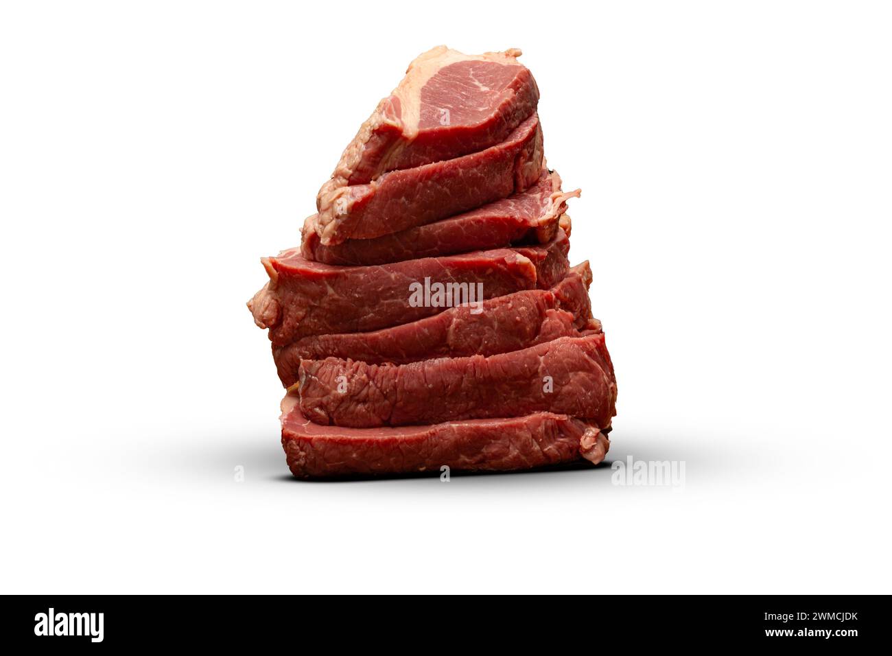 Lots of raw red steaks on a white background Stock Photo - Alamy