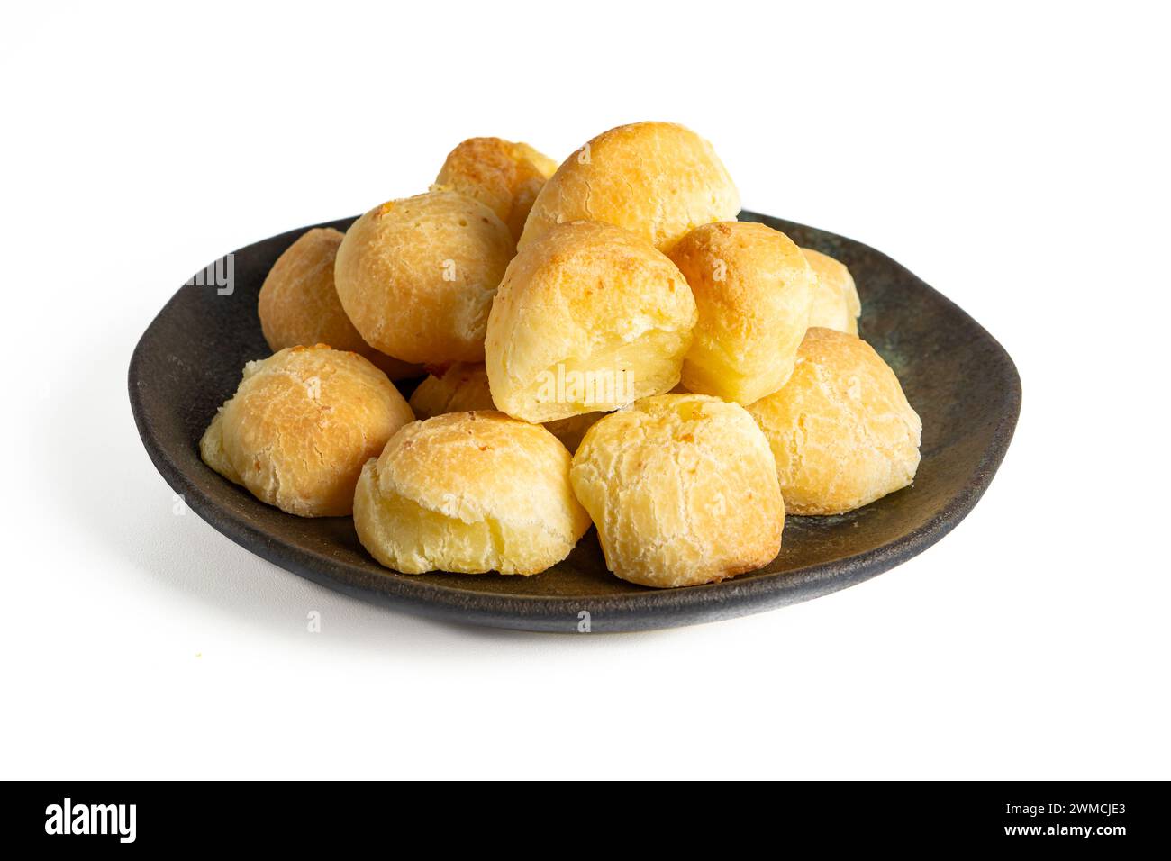 A traditional Brazilian pao de queijo isolated on a white background ...