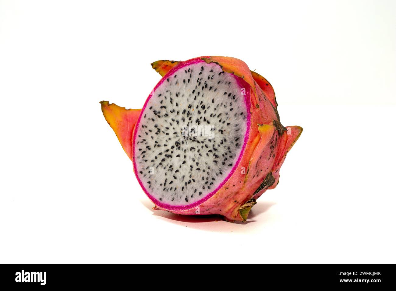 A cut pitaya or dragon fruit isolated on a white background Stock Photo ...