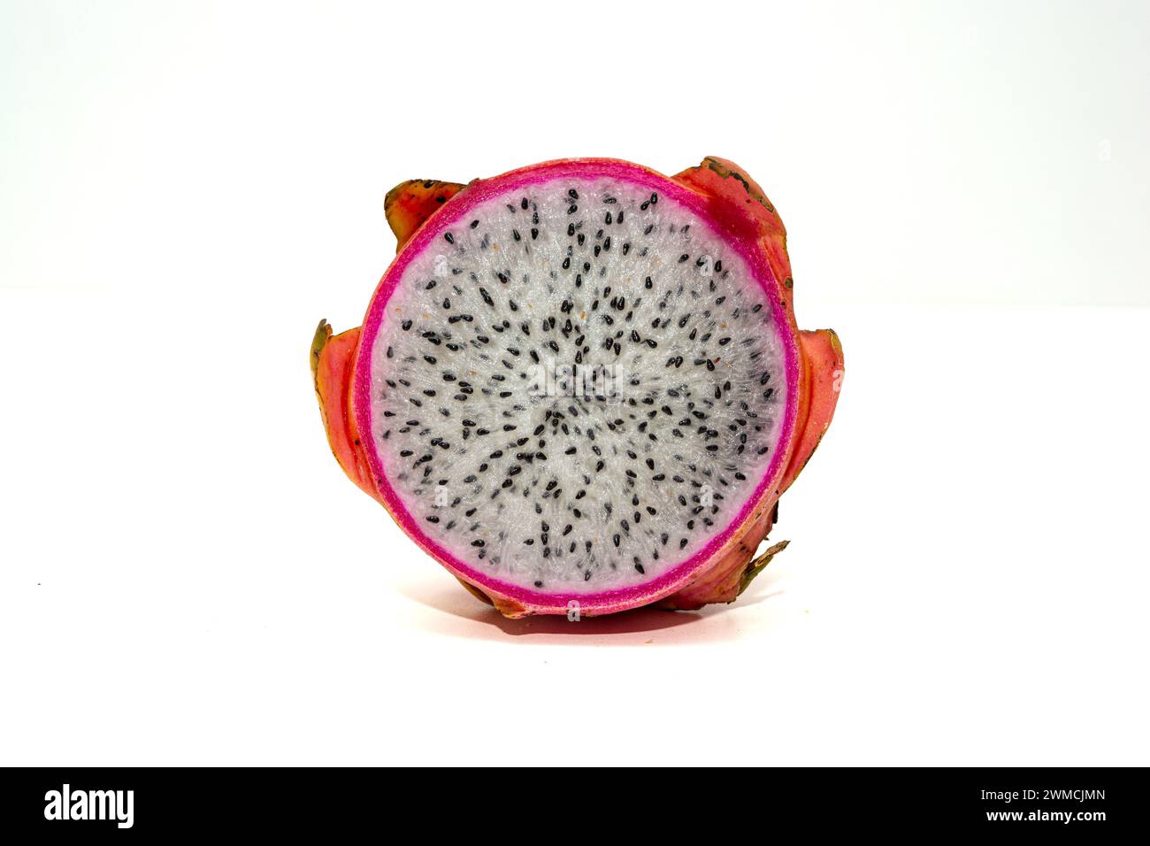 A cut pitaya or dragon fruit isolated on a white background Stock Photo ...