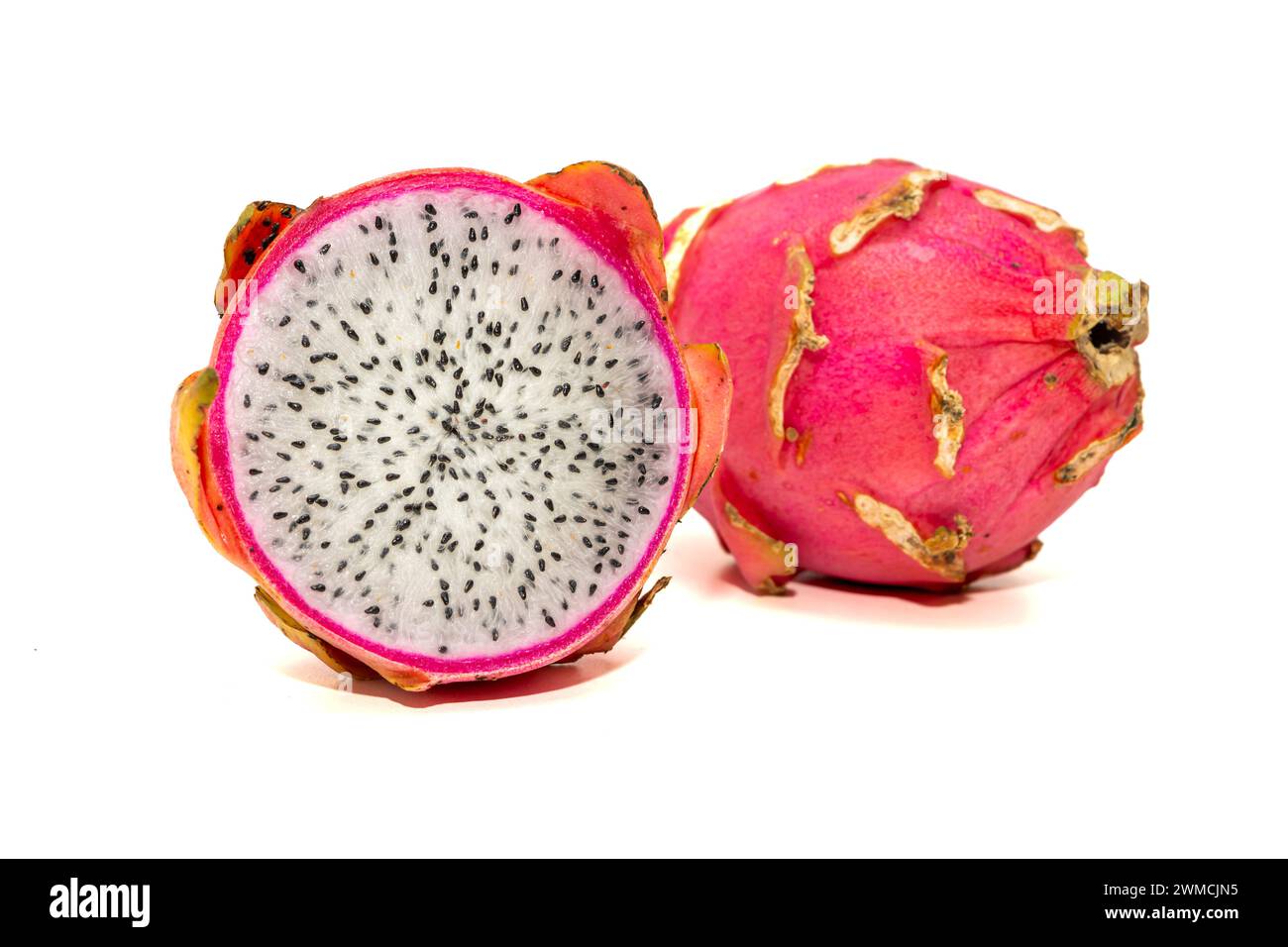 A cut pitaya or dragon fruit isolated on a white background Stock Photo ...