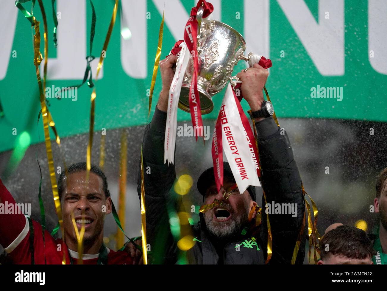 Liverpool manager jurgen klopp lifts the trophy after his team won the ...