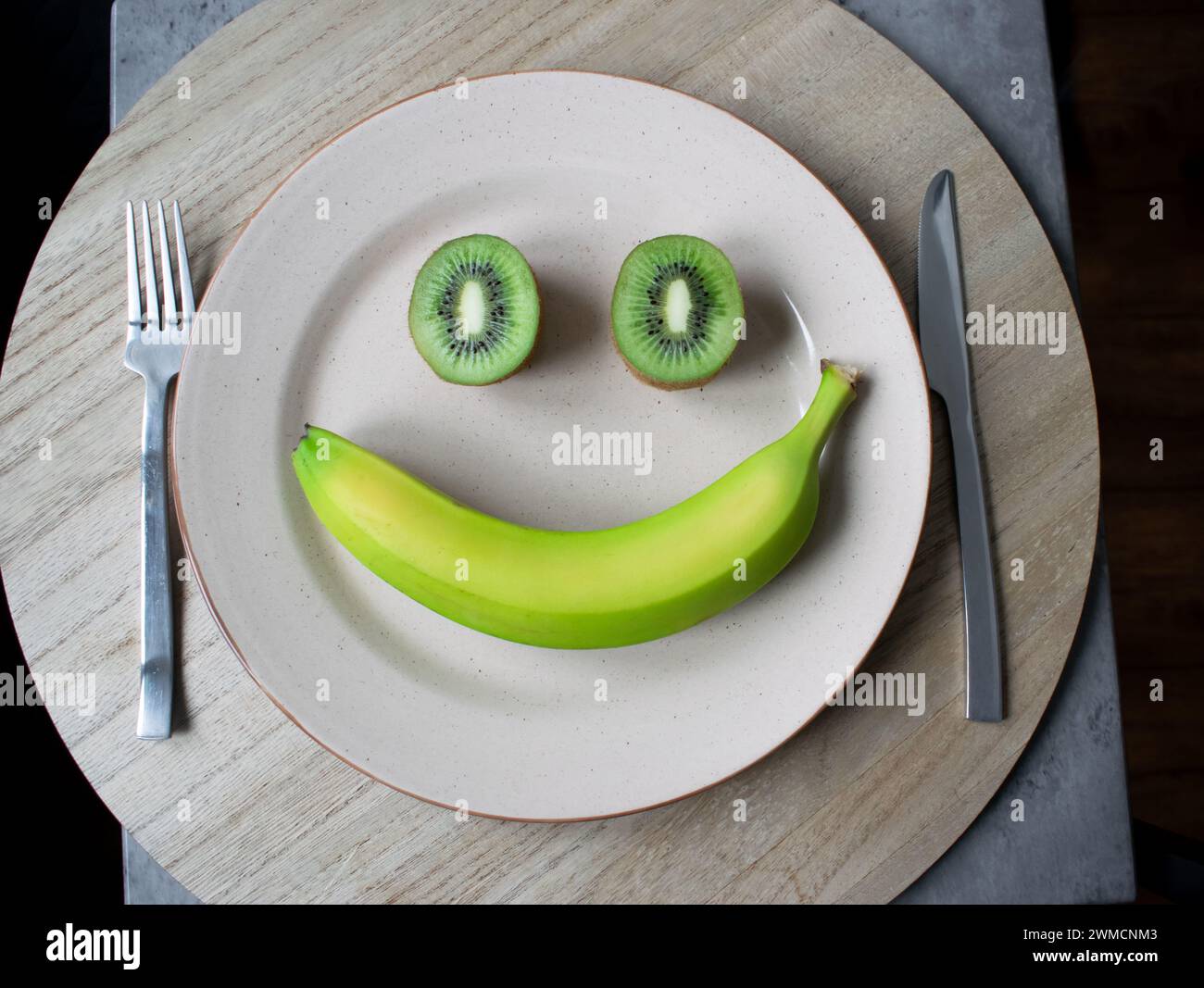 Fruity smiley face on a plate. Happy and healthy diet Stock Photo - Alamy