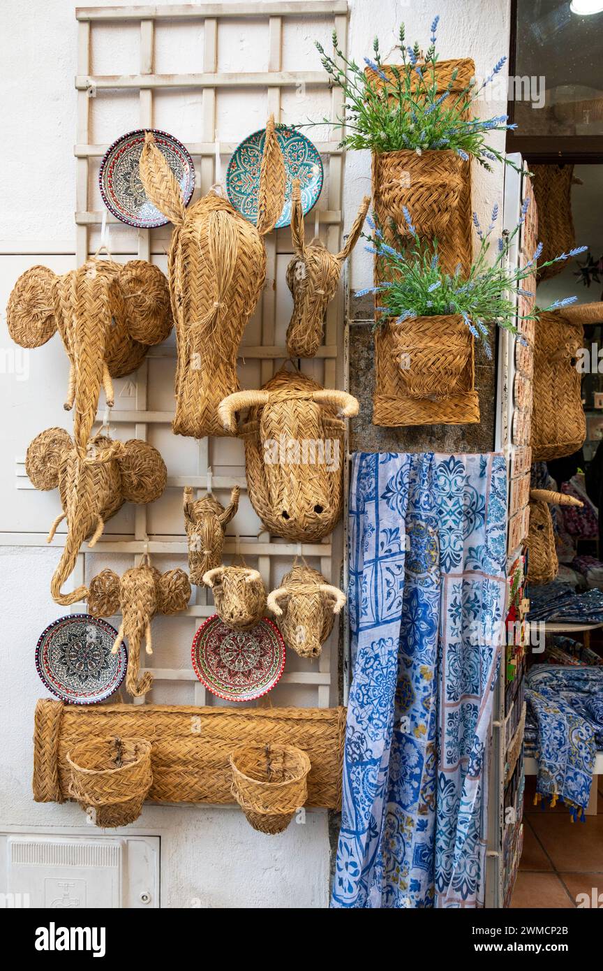 A rack of rattan-made traditional Spanish souvenirs on sale at one of ...