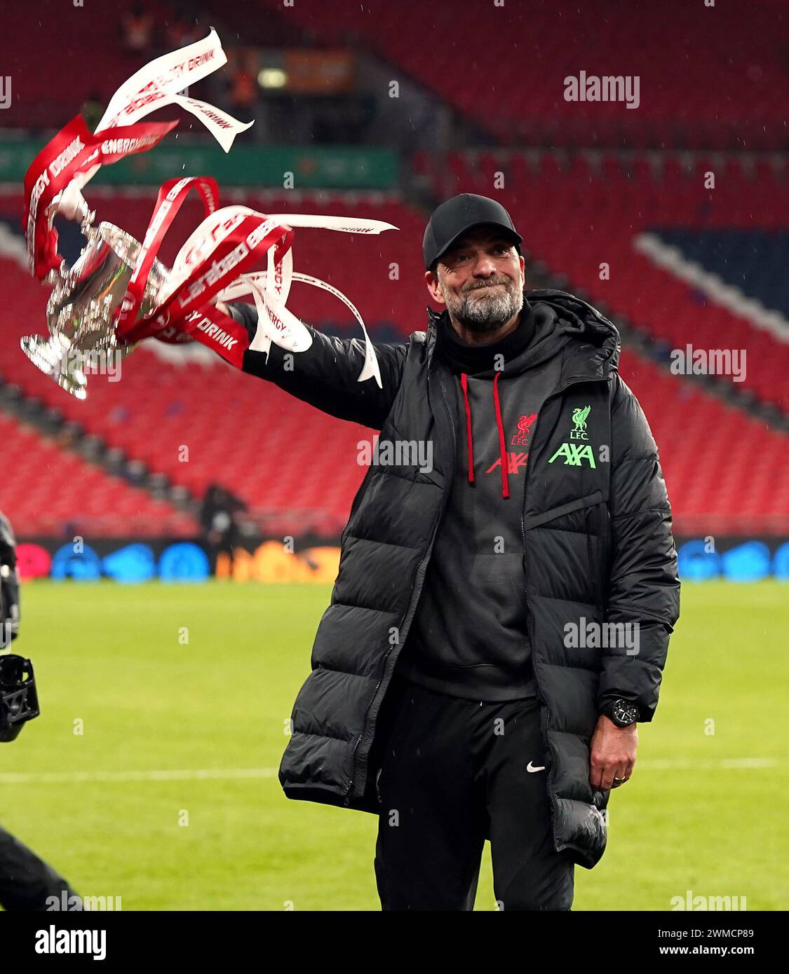 Liverpool manager Jurgen Klopp with the trophy after winning the ...