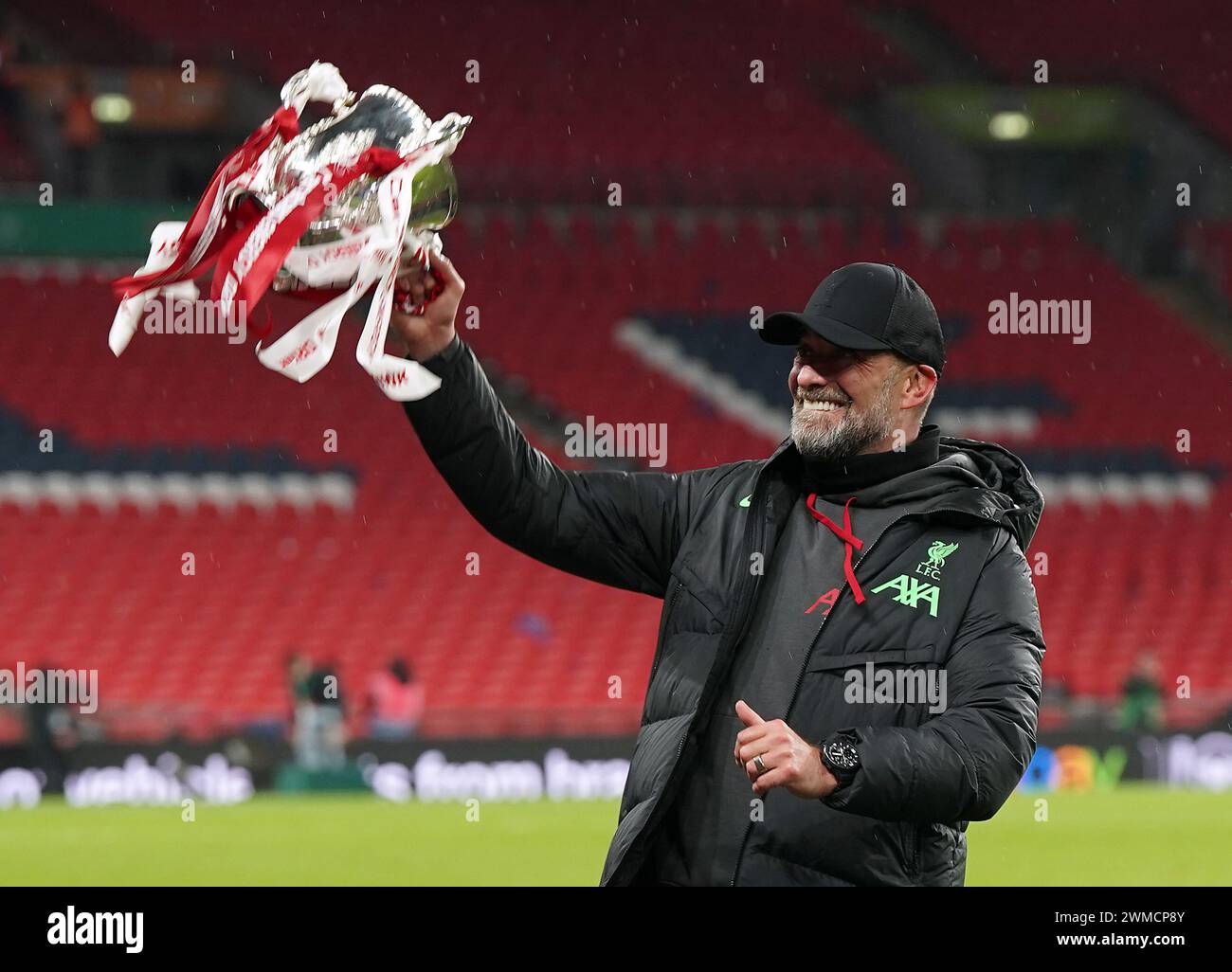 Liverpool manager Jurgen Klopp with the trophy after winning the ...