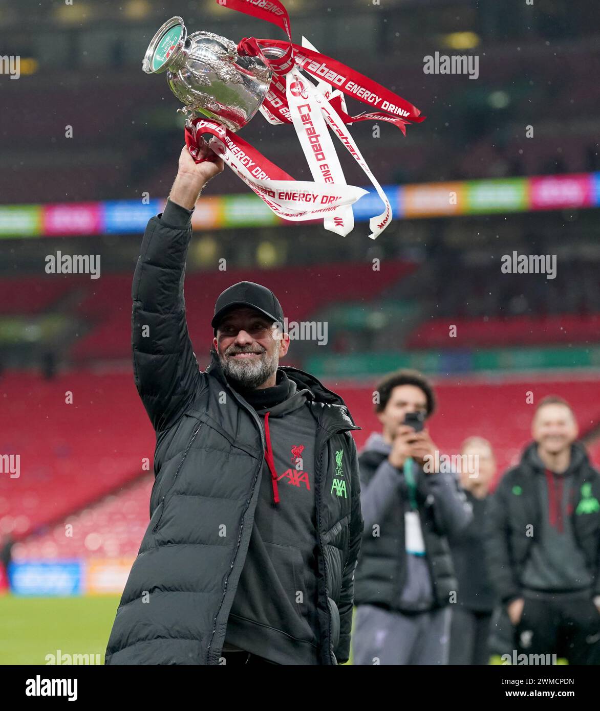 Liverpool manager Jurgen Klopp lifts the trophy after the Carabao Cup final at Wembley Stadium ...