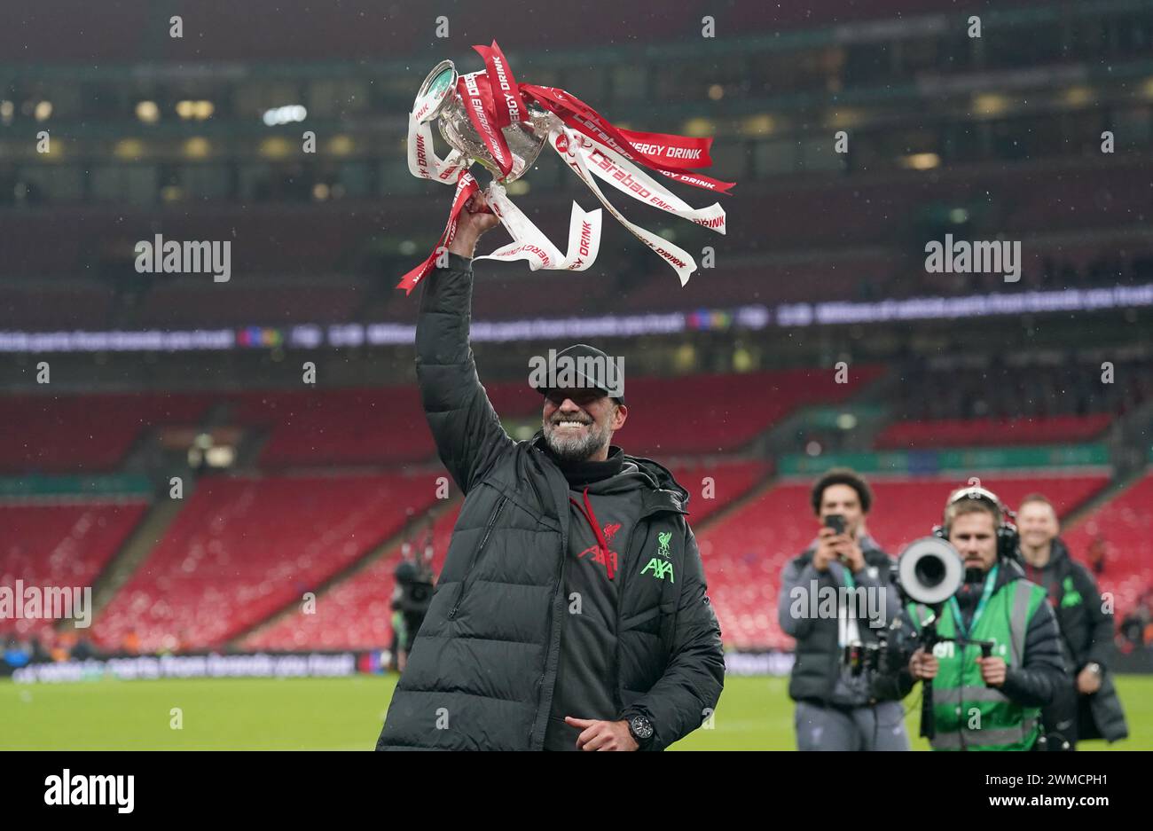 Liverpool manager Jurgen Klopp lifts the trophy after the Carabao Cup ...